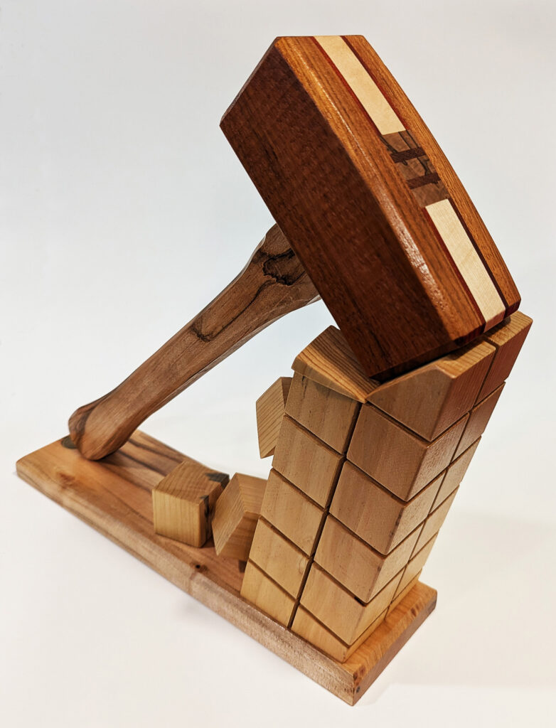 Andy Howard - Tool of Hard Knocks, Wood Sculpture - Lynnwood Today