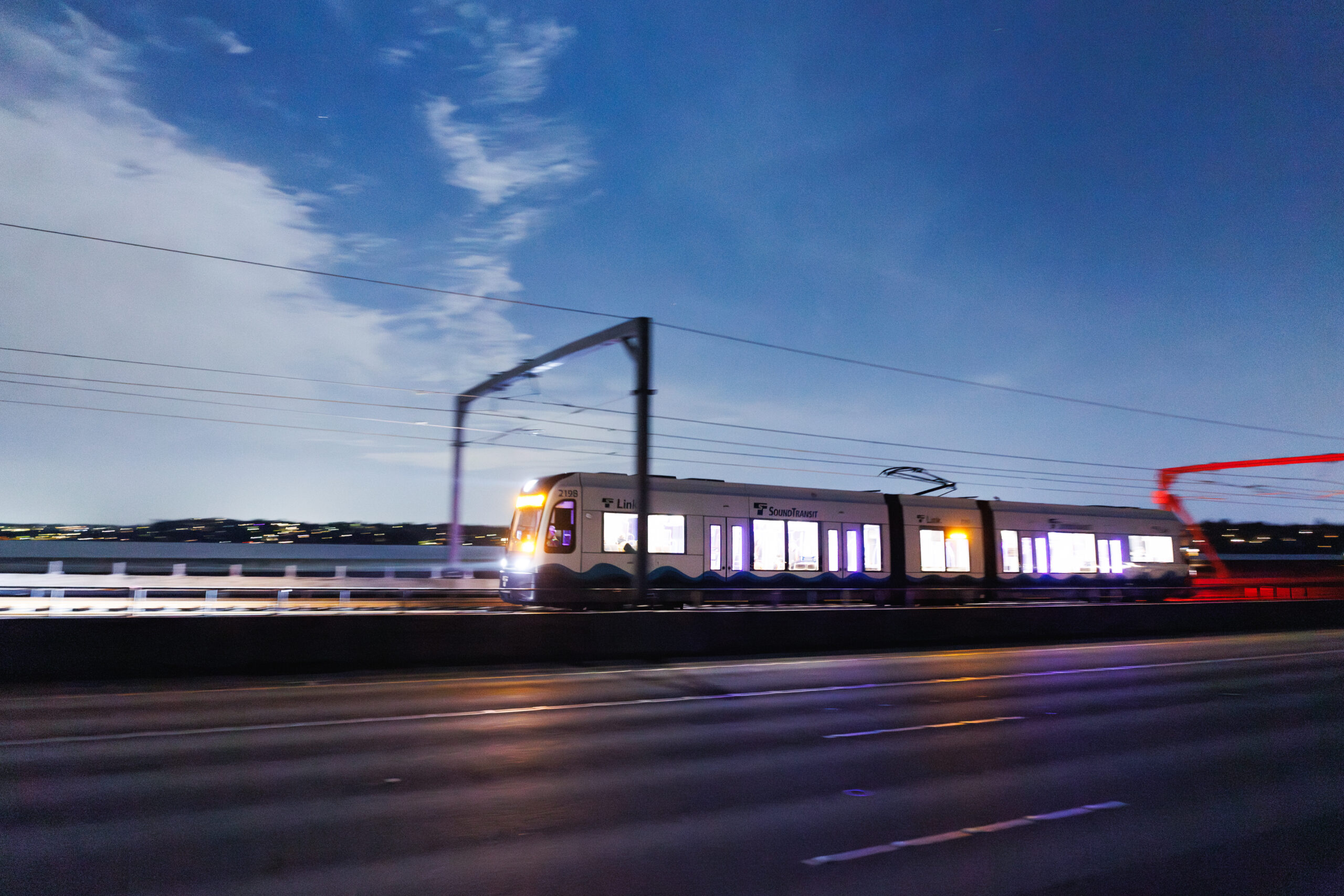 Historic milestone: First powered light rail vehicle crosses I-90 ...